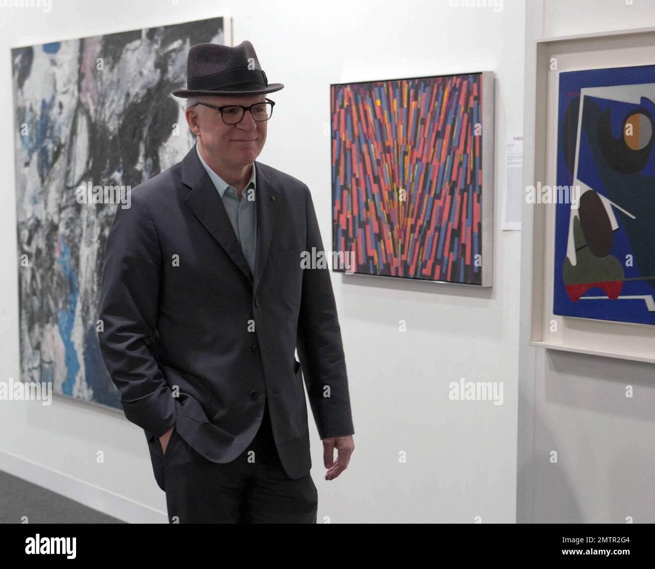 Actor, comedian and musician Steve Martin poses for photos while ...