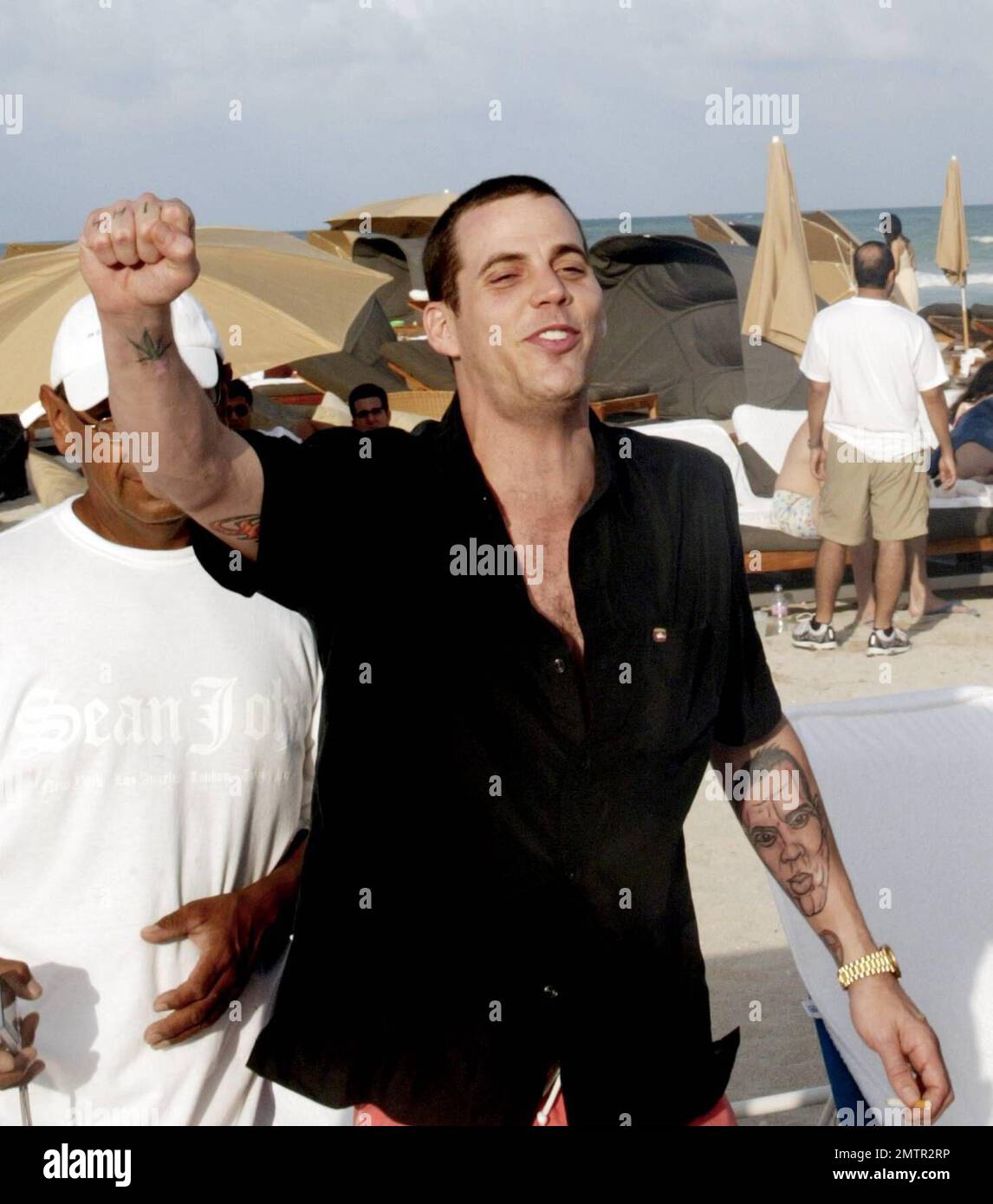Steve-O shows of his tattoos on the beach in Miami, Fl. 12/30/06 Stock ...