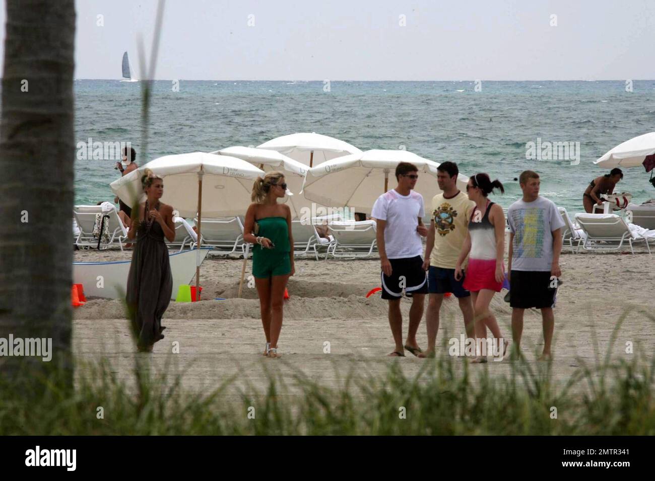 Steven Gerrard, Alex Curran and friends take a stroll on the beach ...