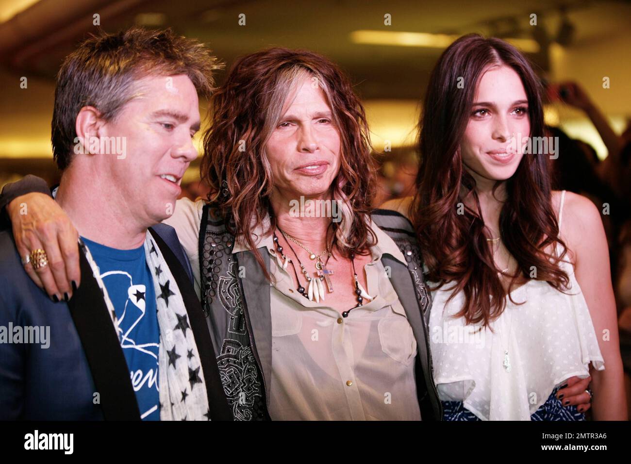 Designer Andy Hilfiger, Steven Tyler and daughter Chelsea Tyler walk ...
