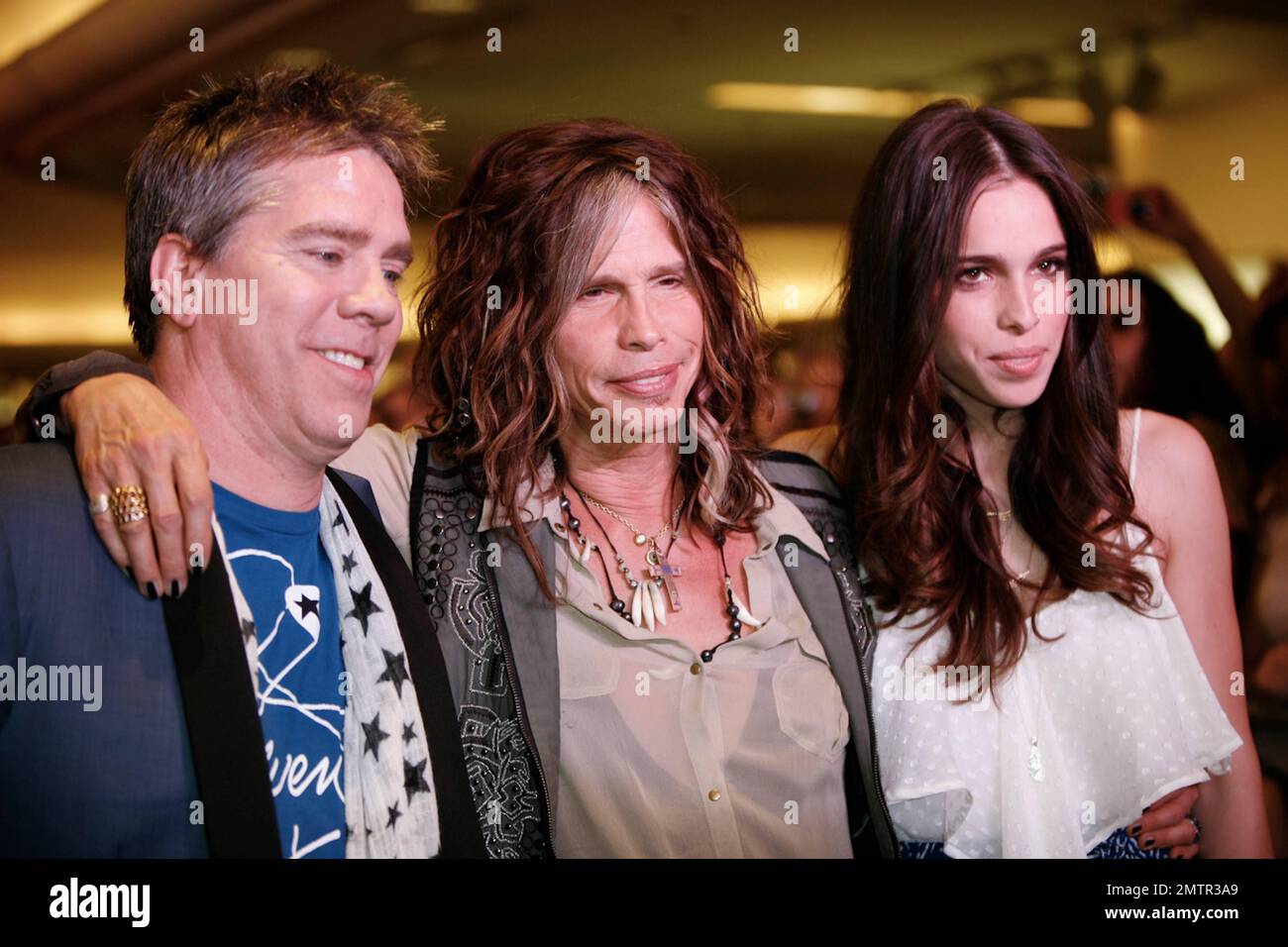 Designer Andy Hilfiger, Steven Tyler and daughter Chelsea Tyler walk ...