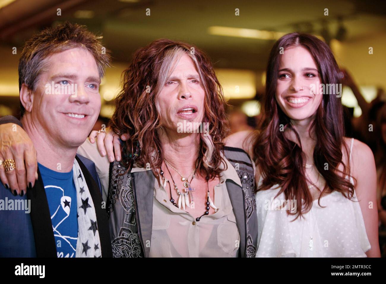 Designer Andy Hilfiger, Steven Tyler and daughter Chelsea Tyler walk ...