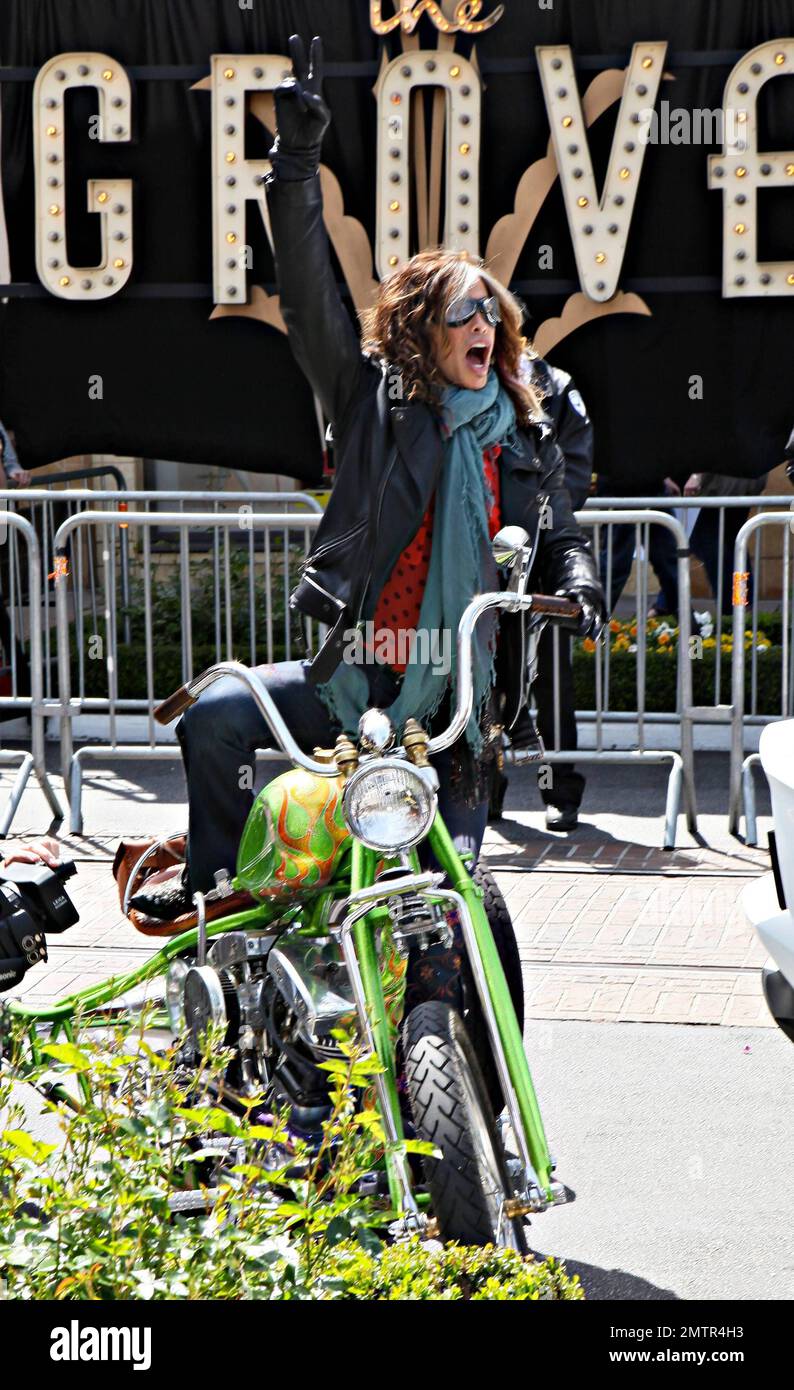Steven Tyler arrives on a custom motorcycle tricycle at the press ...