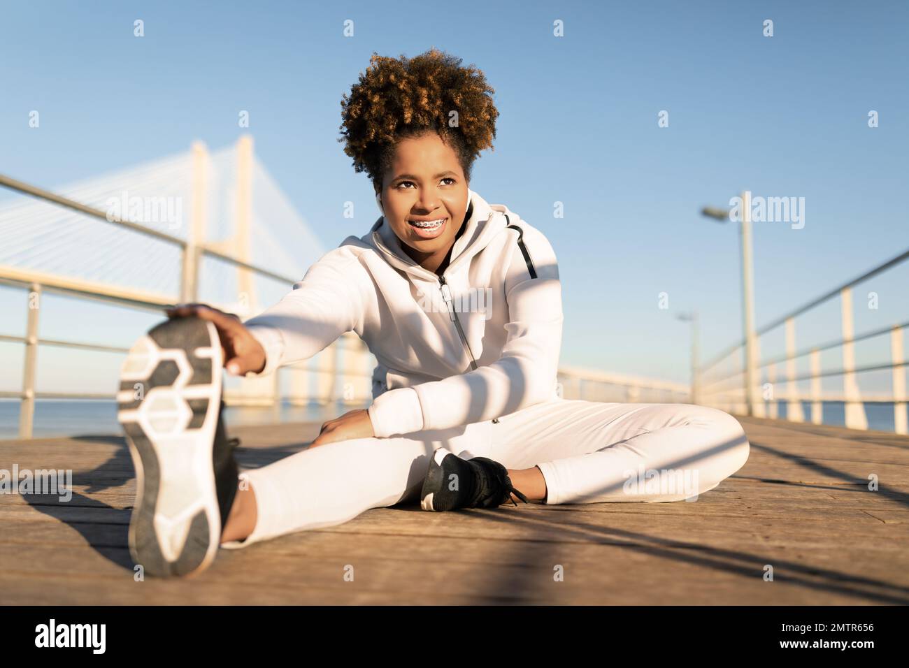 Sporty African American Woman Stretching Leg Muscles After Jogging ...