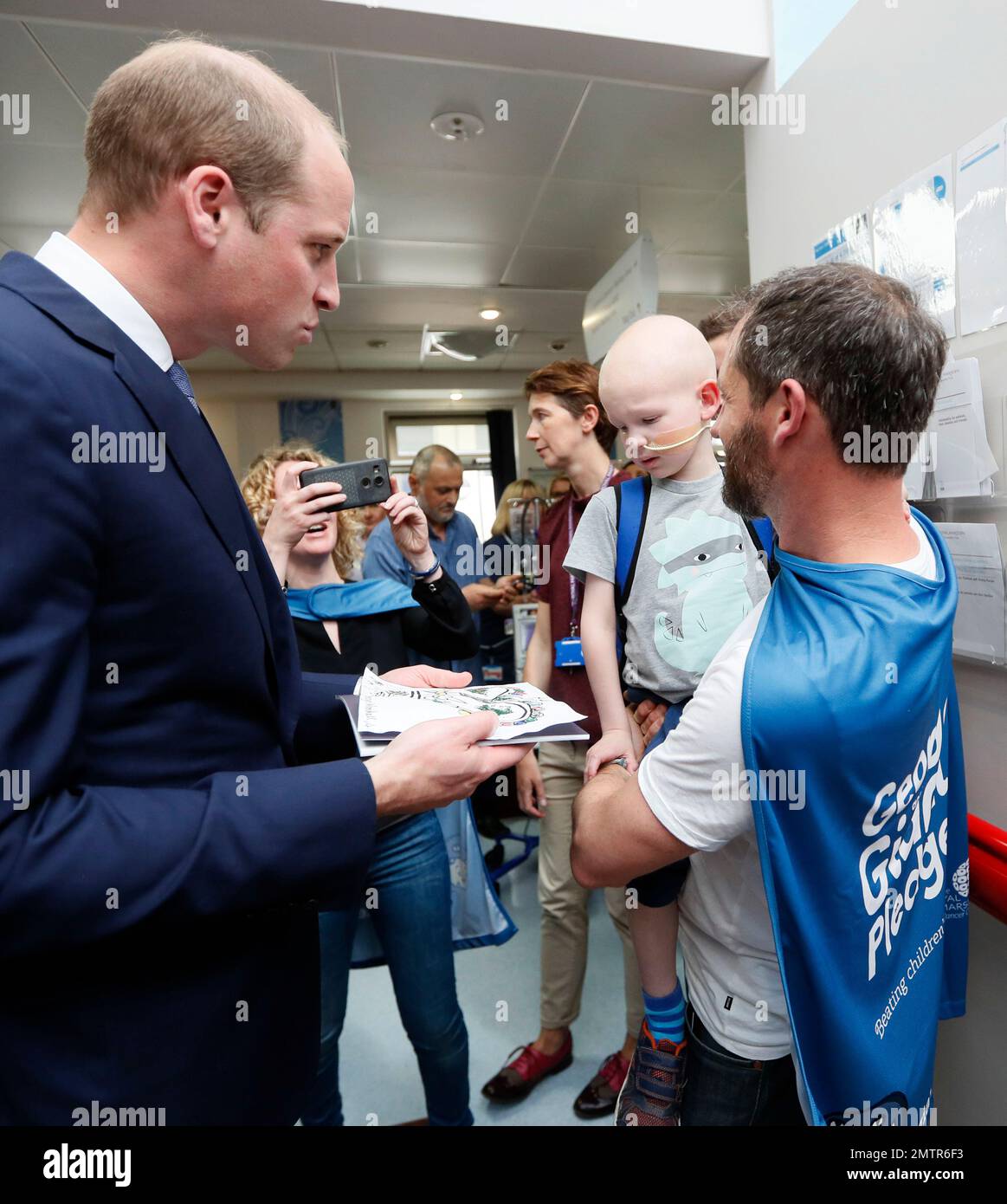 Britain's Prince William meets patient George Woodall, 4, during a ...