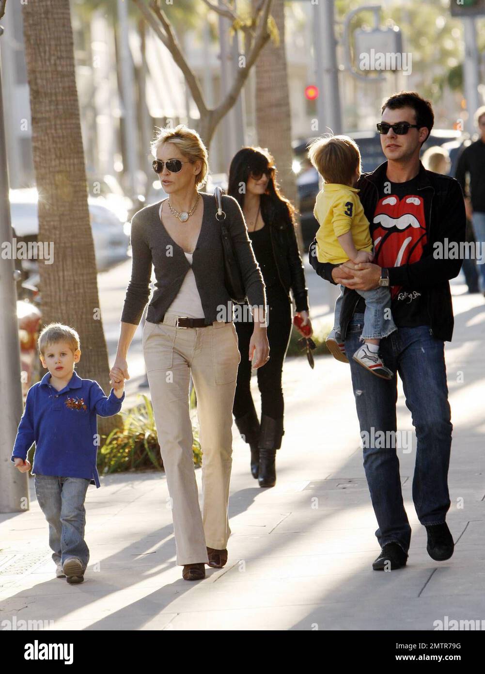 A very busty Sharon Stone was joined by her boyfriend and sons Laird ...
