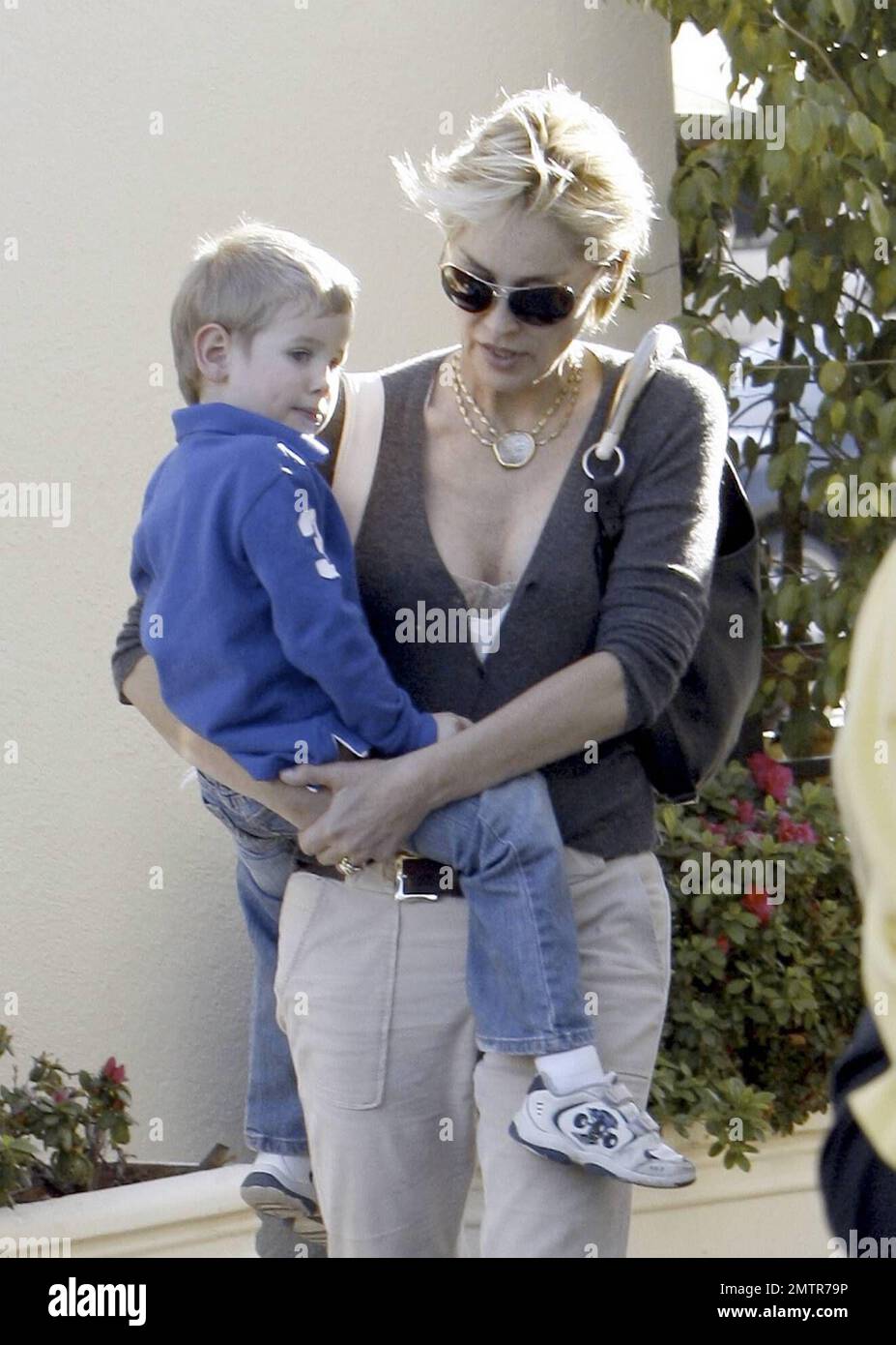 A very busty Sharon Stone was joined by her boyfriend and sons Laird ...