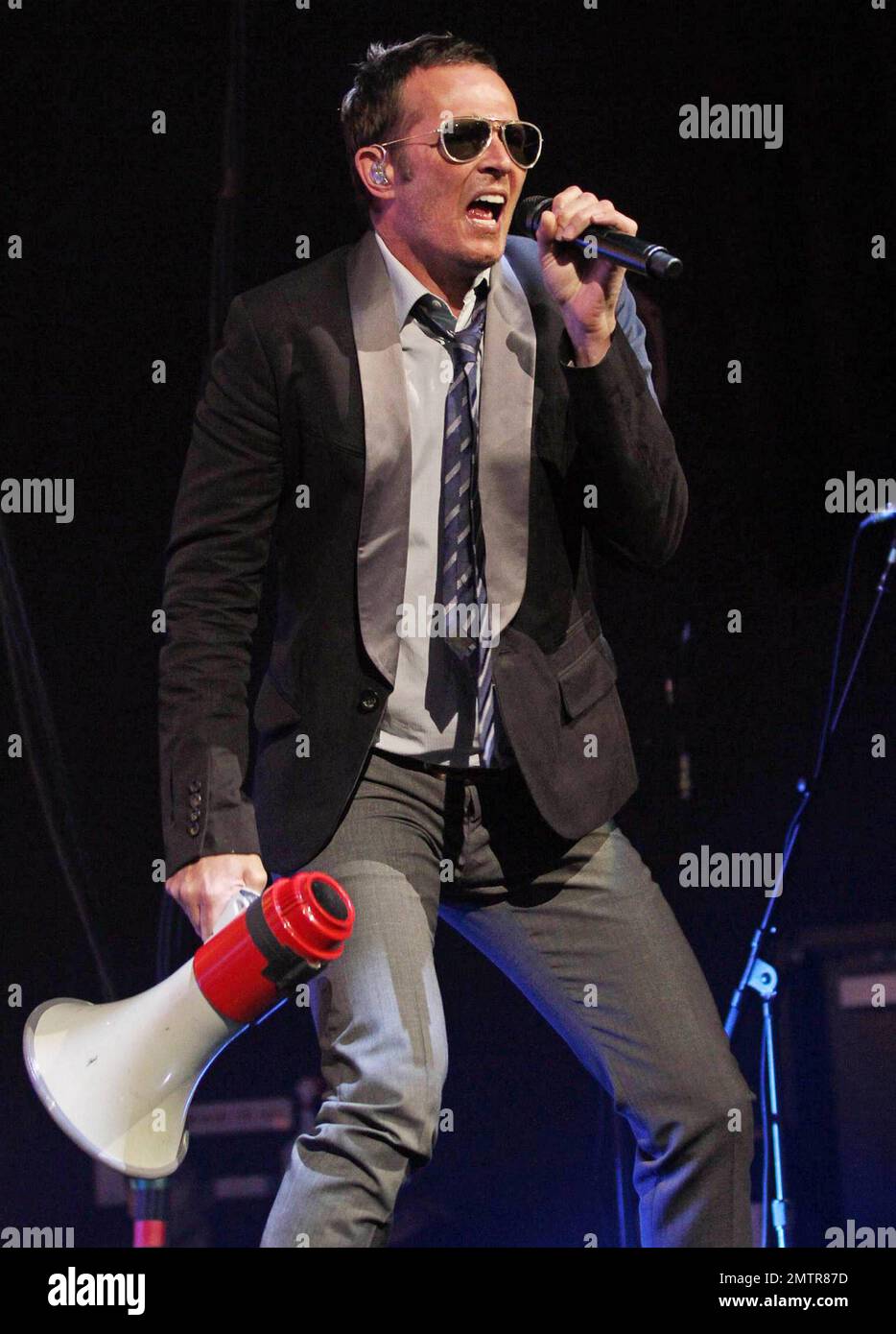 Scott Weiland, lead singer of Stone Temple Pilots, performs with a ...