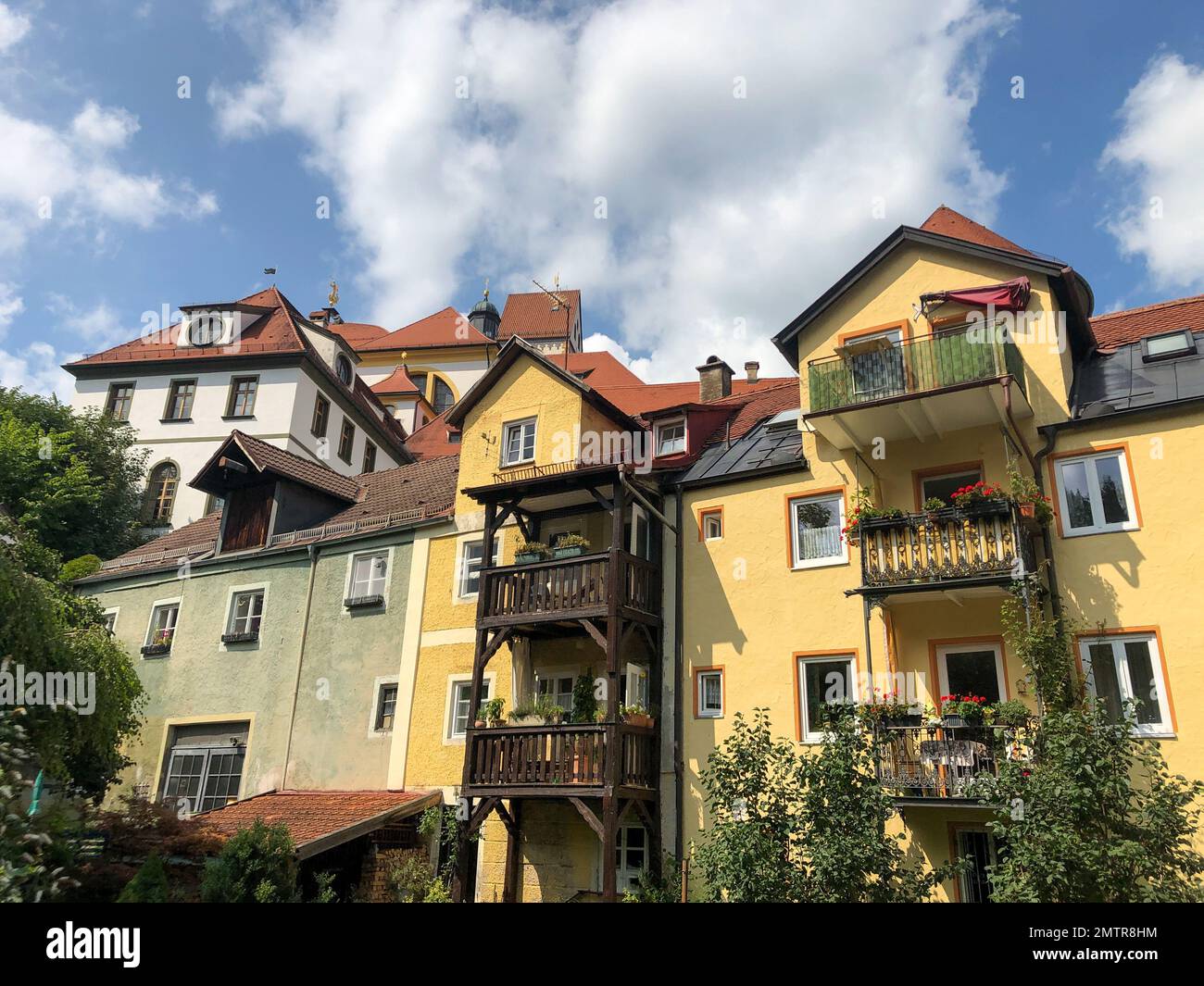 The facades of beautiful buildings with balconies in the Fussen town in ...
