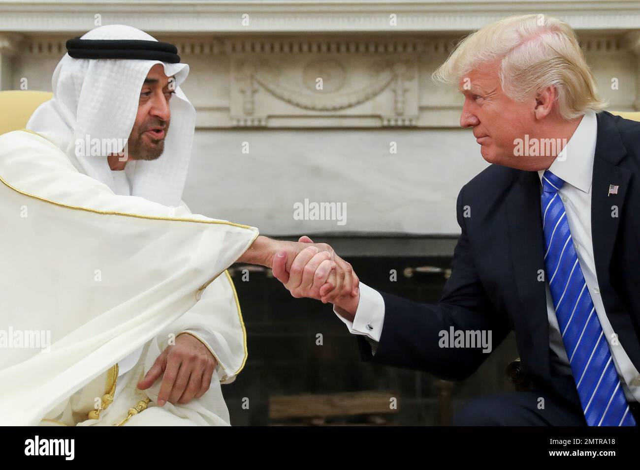 President Donald Trump shakes hands with Abu Dhabi's Crown Prince ...