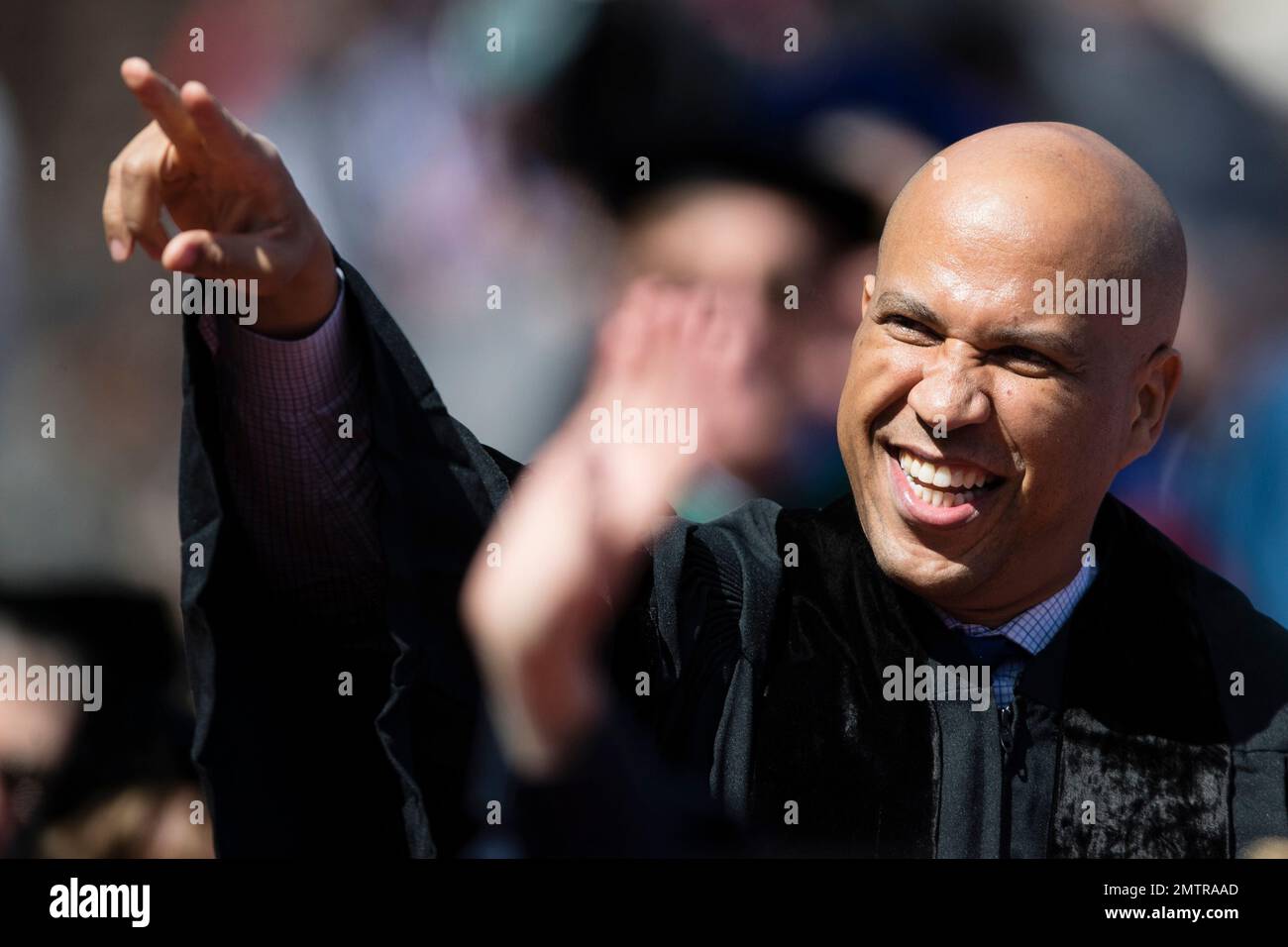 U.S. Sen. Cory Booker, D-N.J., walks onto the field during the ...