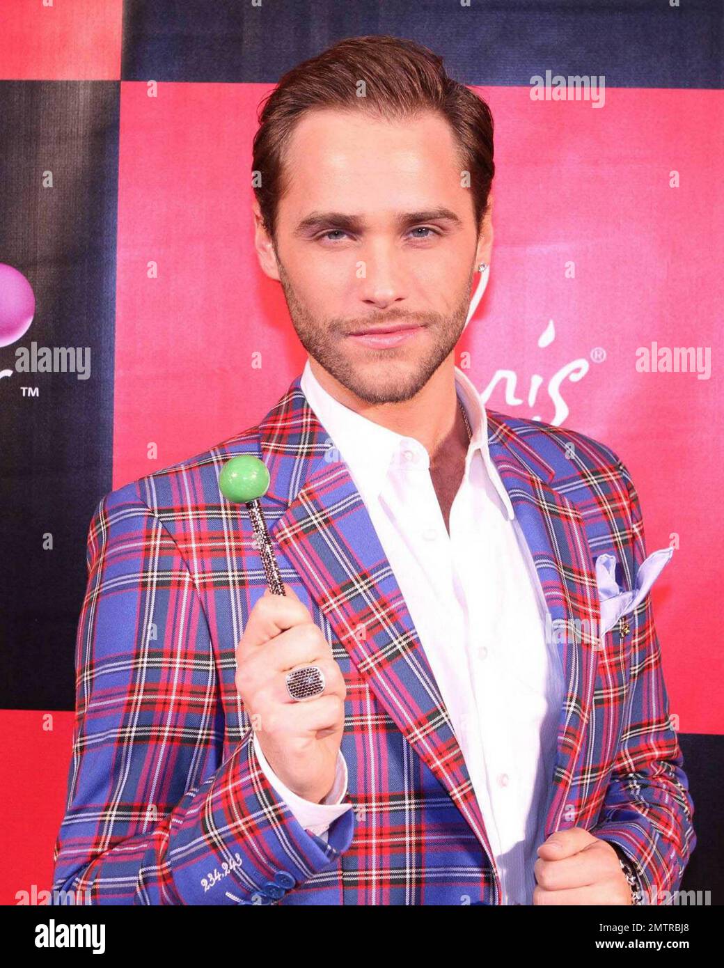 Josh Strickland poses for photographers at the grand opening of the ...