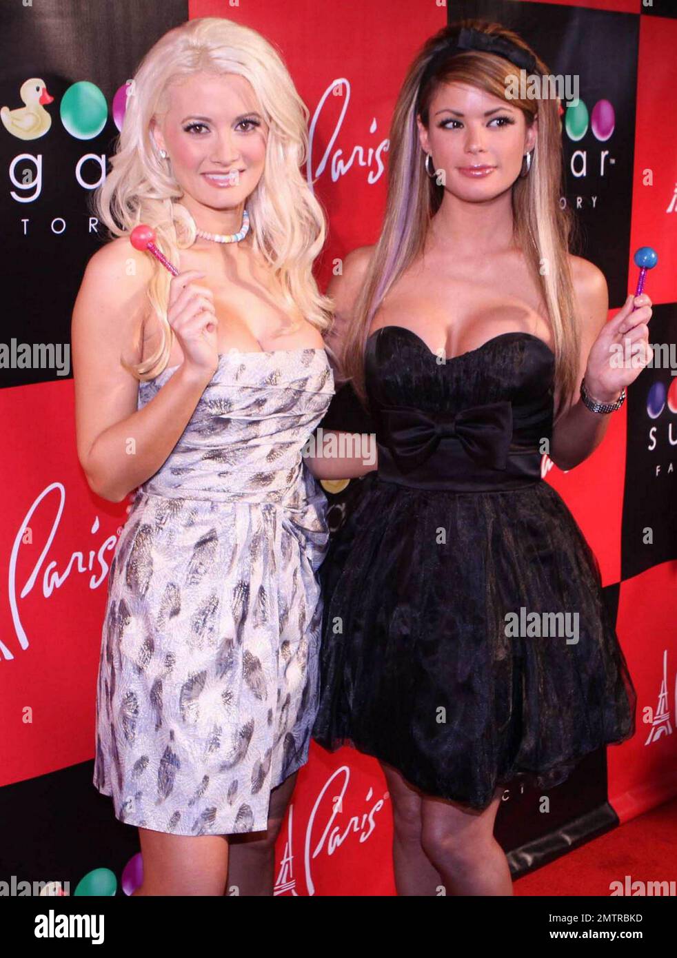 Holly Madison and Laura Croft pose for photographers at the grand opening of the Sugar Factory ...
