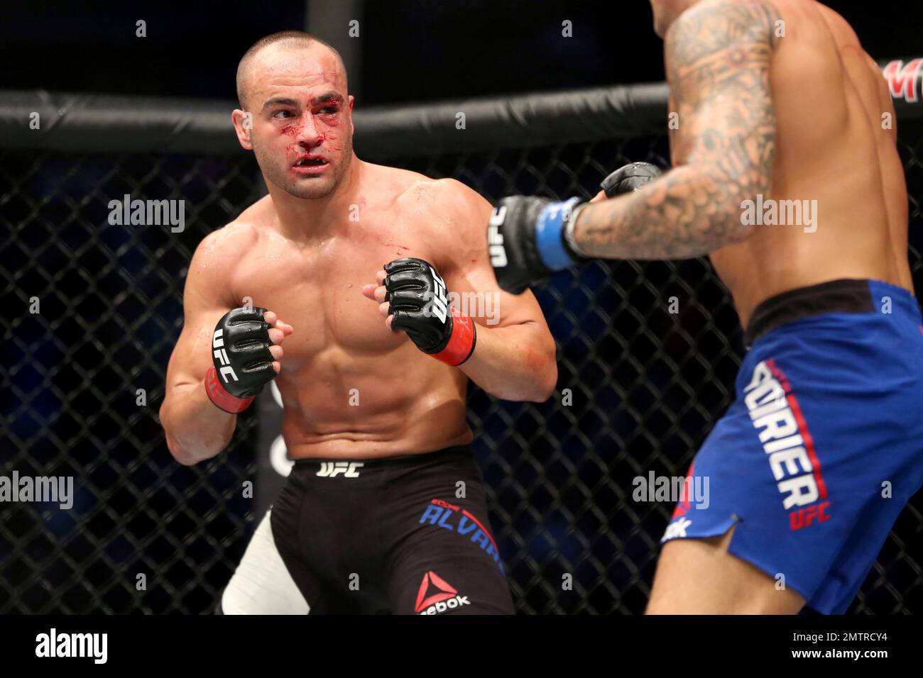 Eddie Alvarez fights Dustin Poirier in a mixed martial arts bout at UFC ...