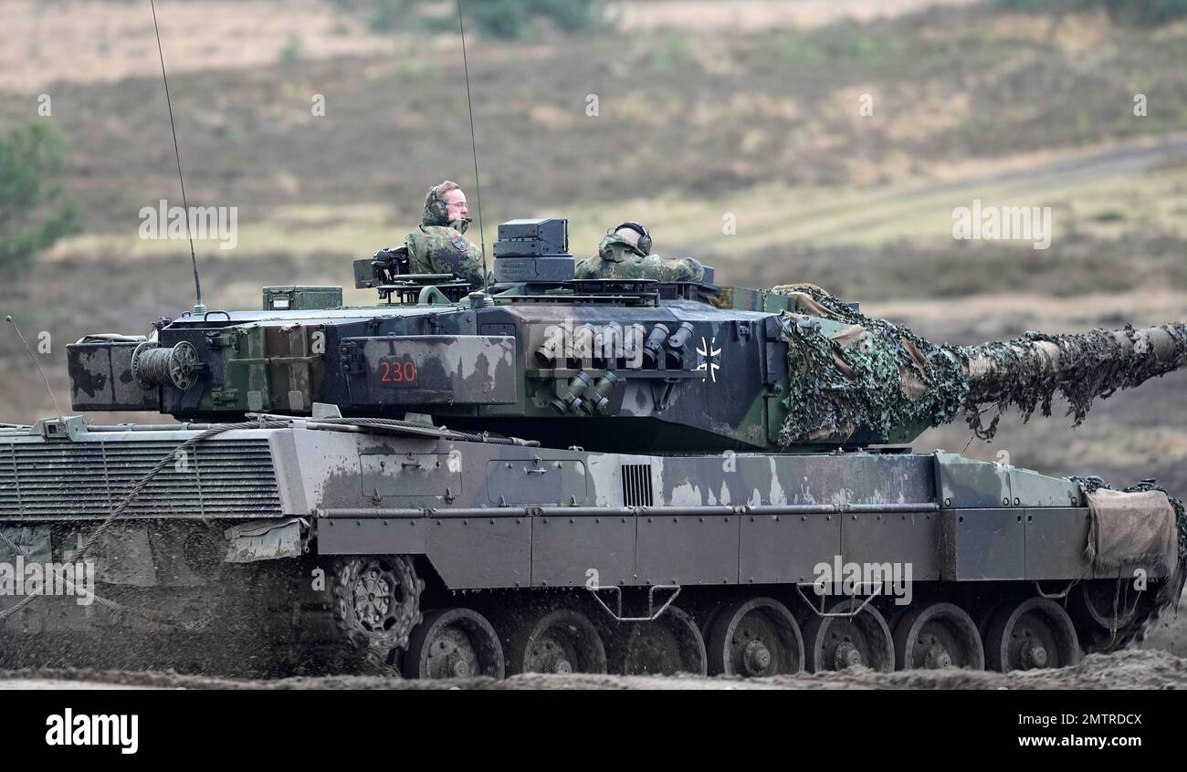 German Defense Minister Boris Pistorius drives on a Leopard 2 tank during a visit at the ...