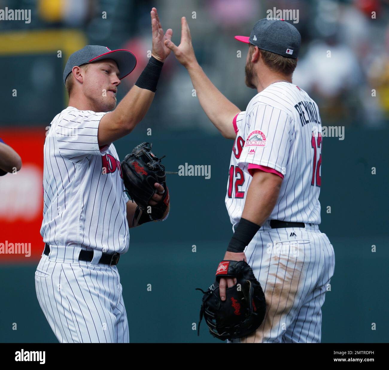 Colorado Rockies shortstop Pat Valaika, left, is congratulated by first ...
