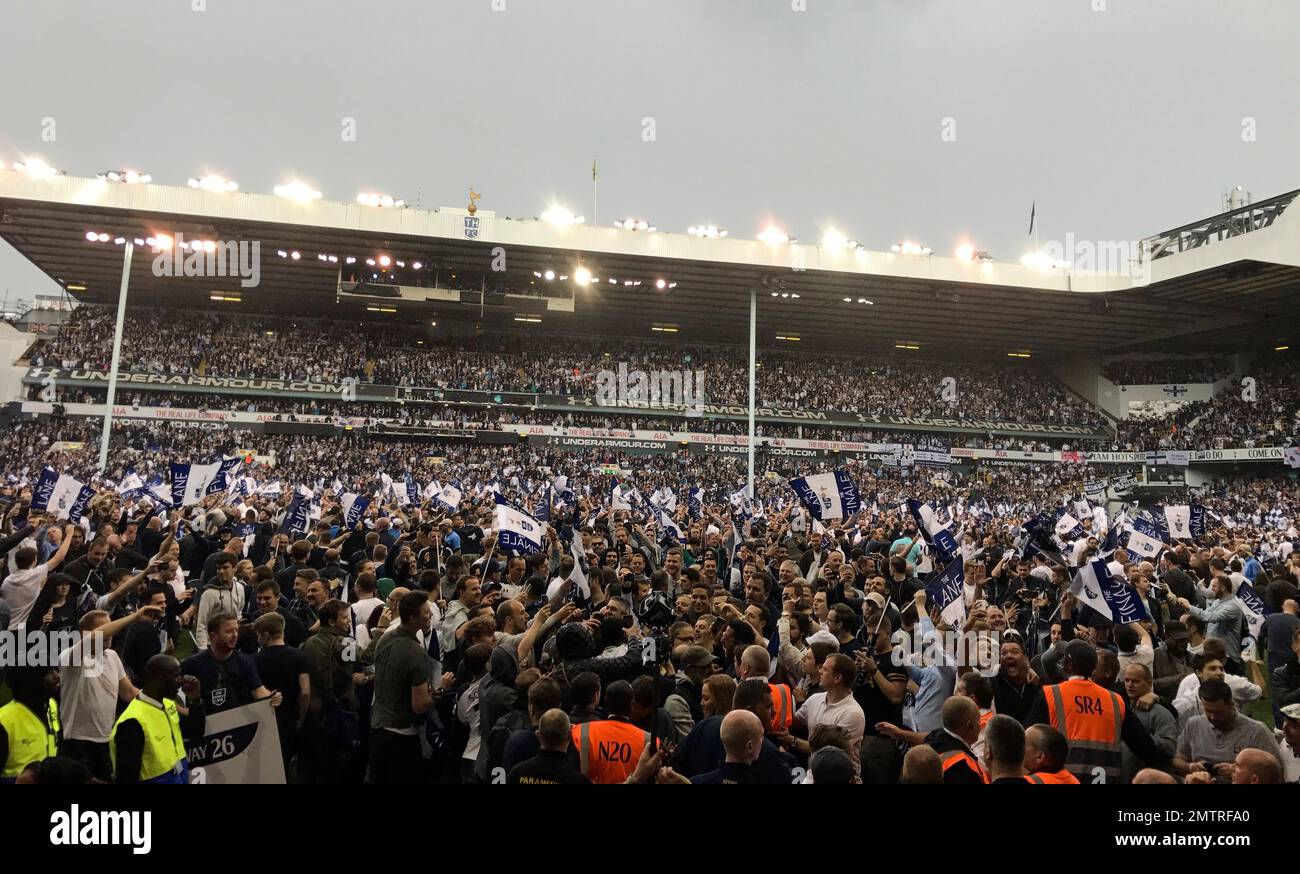 Fans invade the pitch after the English Premier League soccer match ...