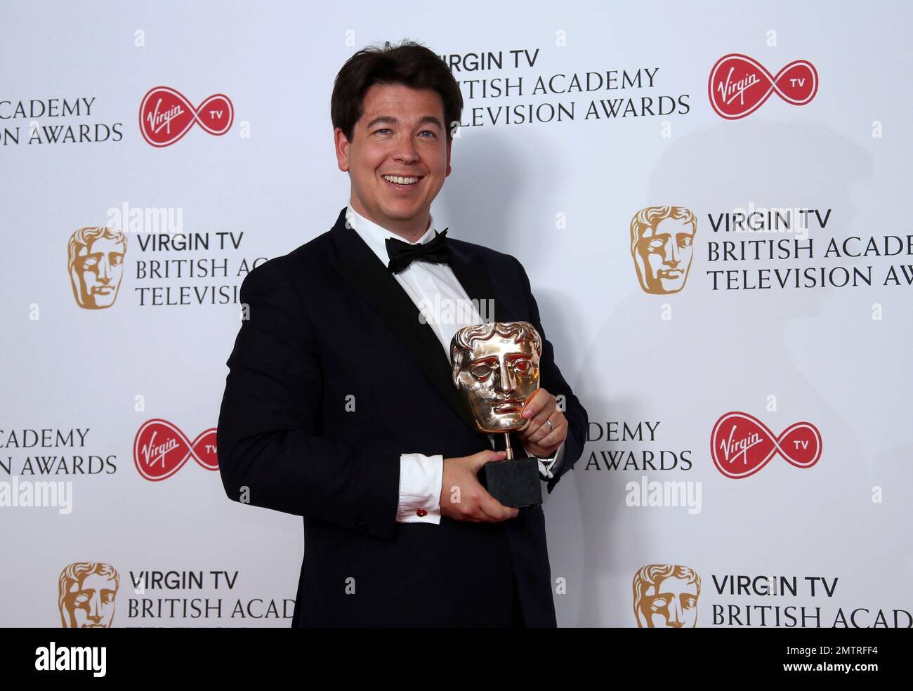 Comedian Michael McIntyre poses with his Bafta for Best Entertainment ...