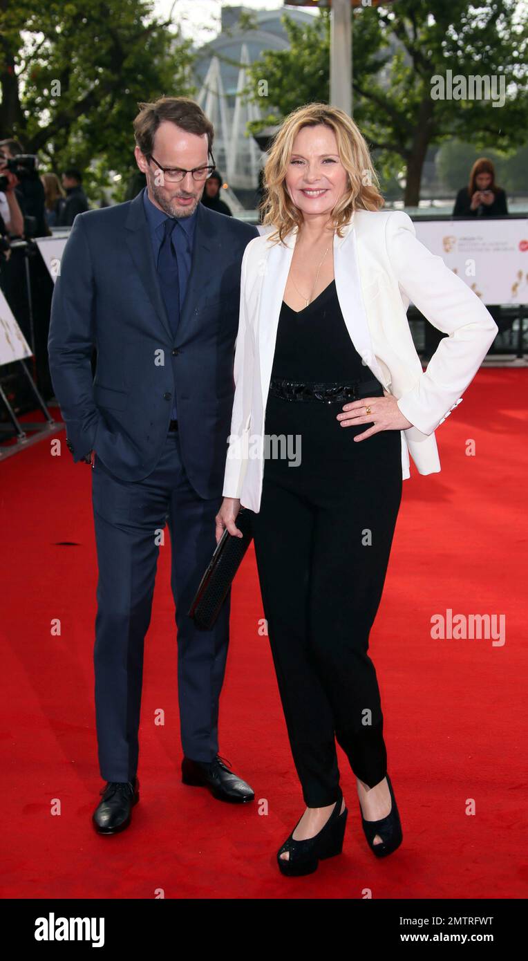 Actress Kim Cattrall and guest pose for photographers upon arrival to ...