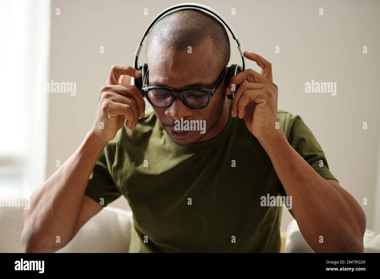 Candid man listening song hi-res stock photography and images - Alamy