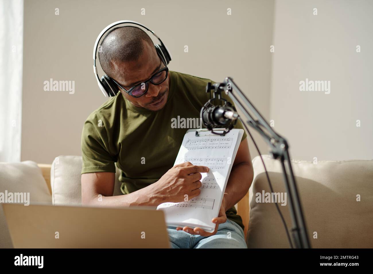 Music teacher conducting online class on music notes Stock Photo - Alamy