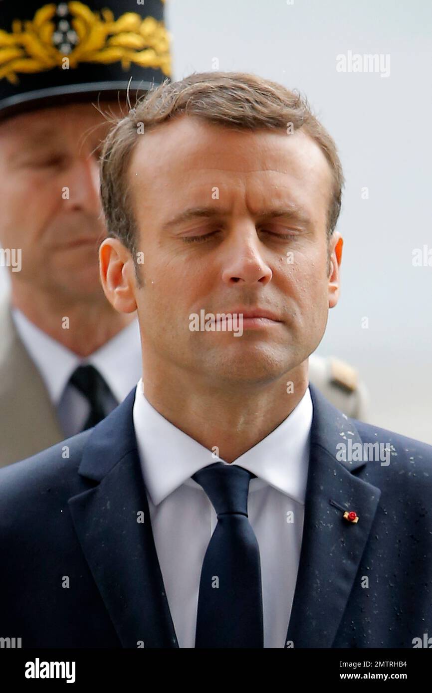 New French President Emmanuel Macron observes a minute of silence ...