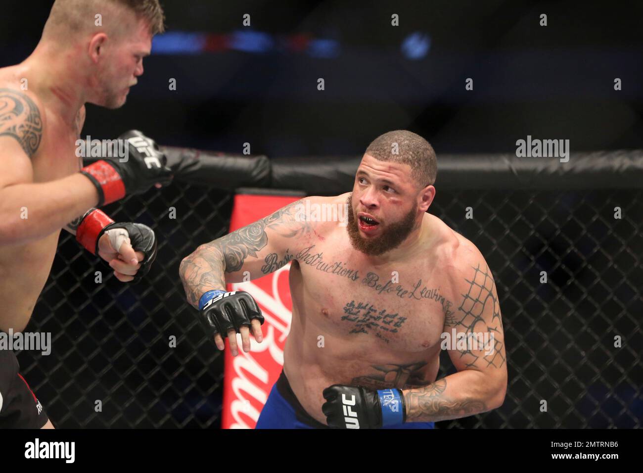 Chase Sherman, left, fights Rashad Coulter in a mixed martial arts bout ...