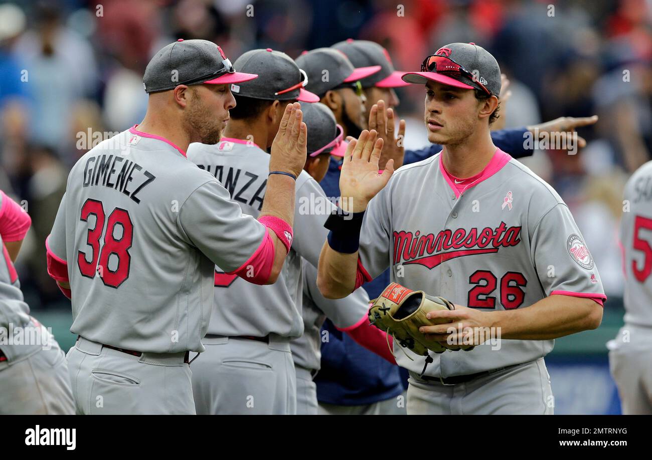 Minnesota Twins' Max Kepler (26) is congratulated by teammates after ...