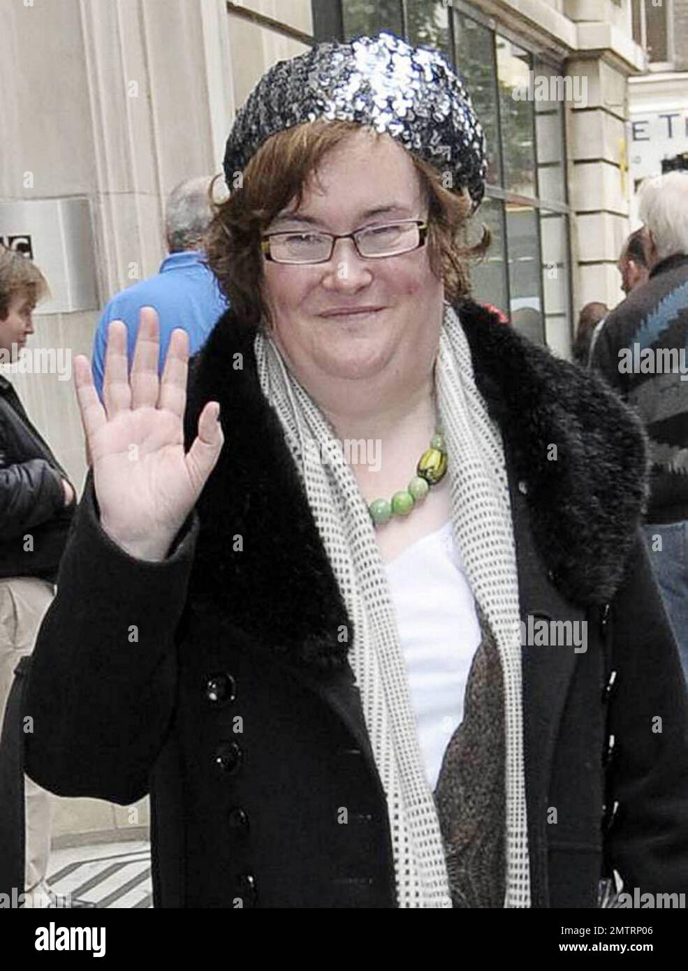 Singer Susan Boyle smiles and waves as she arrives at BBC Radio where ...