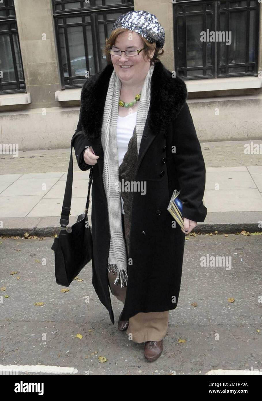 Singer Susan Boyle smiles and waves as she arrives at BBC Radio where ...