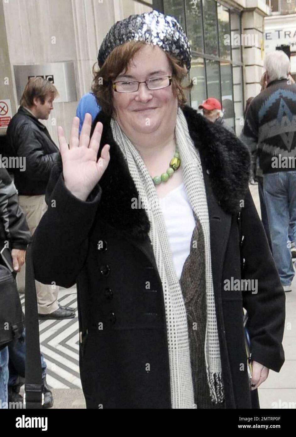 Singer Susan Boyle smiles and waves as she arrives at BBC Radio where ...