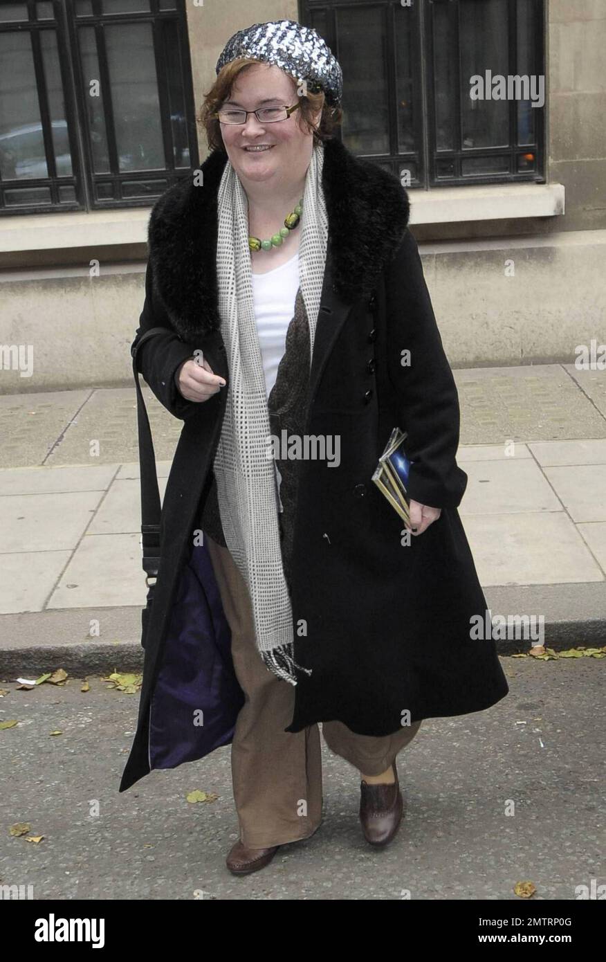 Singer Susan Boyle smiles and waves as she arrives at BBC Radio where ...