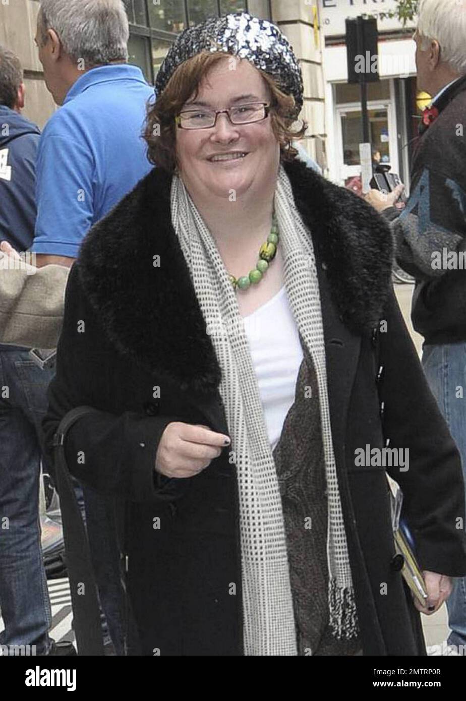Singer Susan Boyle smiles and waves as she arrives at BBC Radio where ...