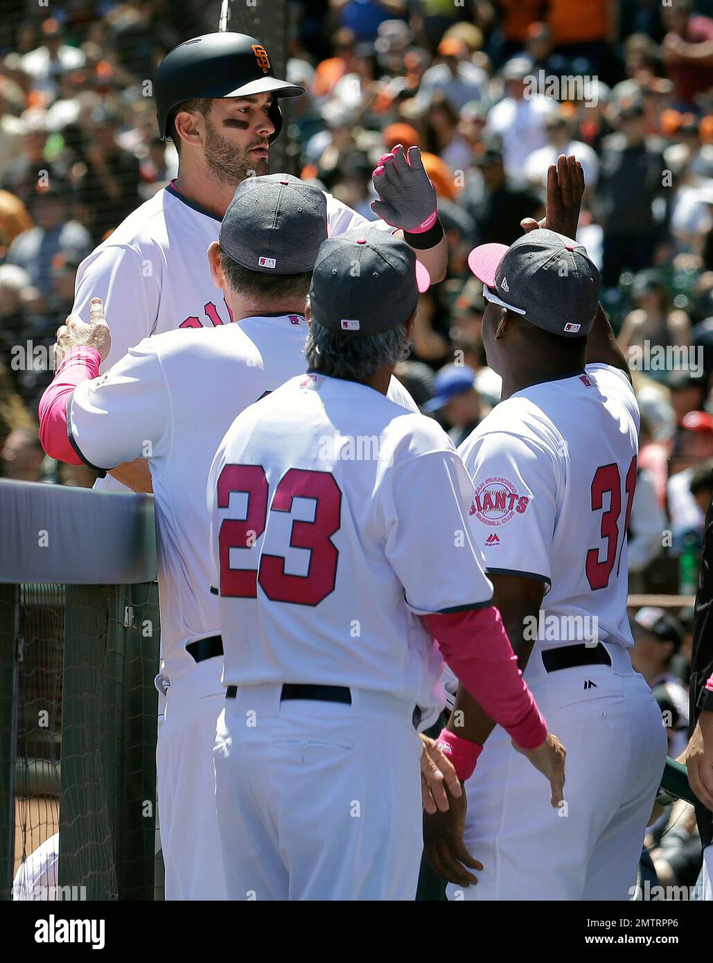 San Francisco Giants' Justin Ruggiano, top left, is congratulated after ...