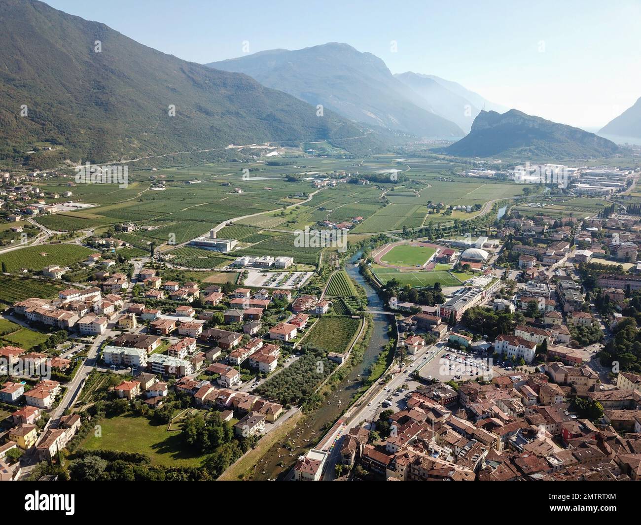 An aerial of the beautiful old houses of the Arco commune in Italy on a ...