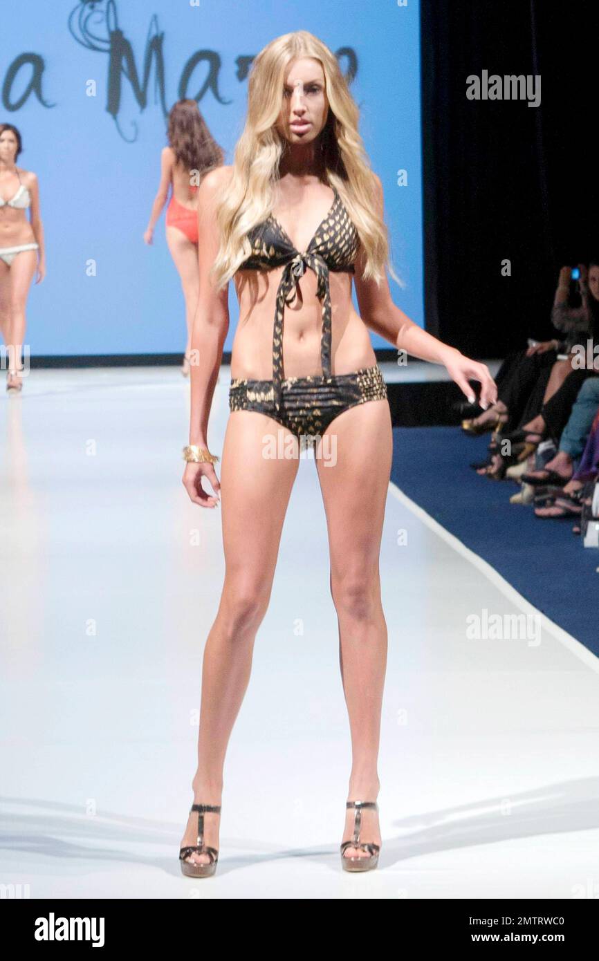 A model walks the runway showing off a Lisa Maree design at Swimshow Australia during Australian ...