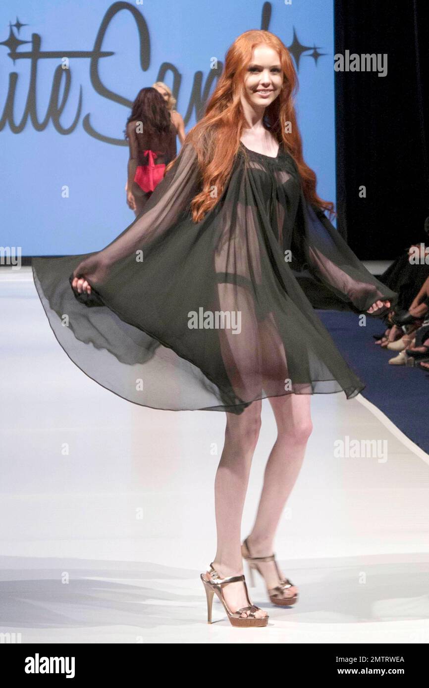 A model walks the runway showing off a White Sands design at Swimshow ...