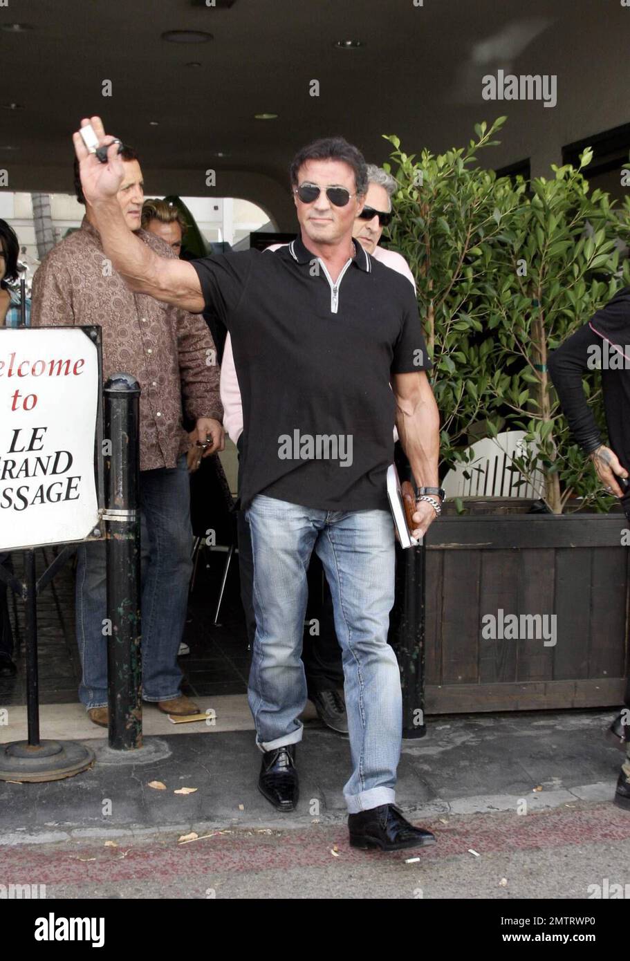 Sylvester Stallone leaves a Beverly Hills cafe with friends after ...