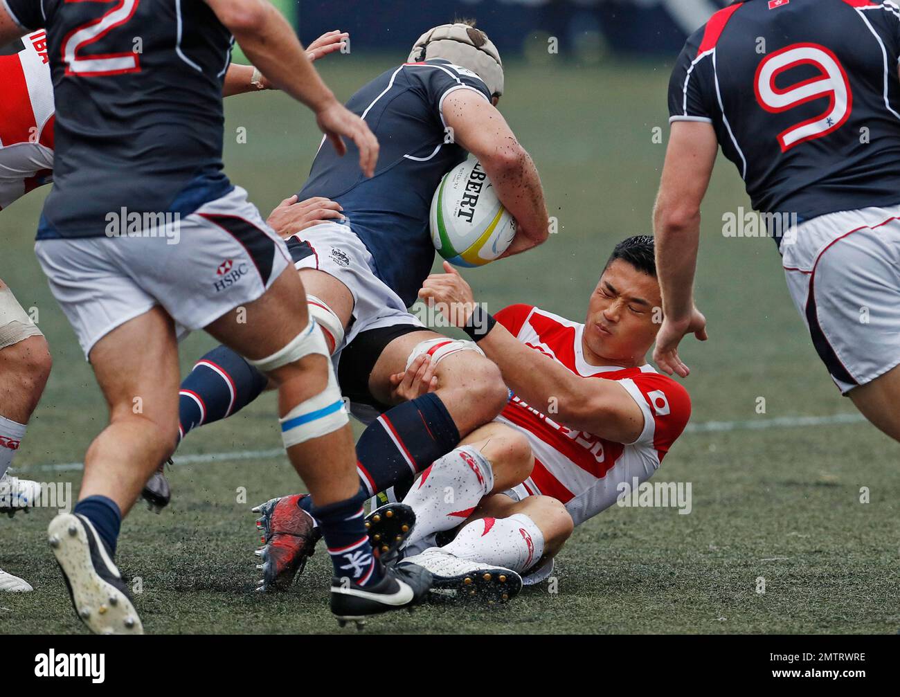 CORRECTS NAMES OF PLAYERS - Hong Kong's Nick Hewson, second from left ...