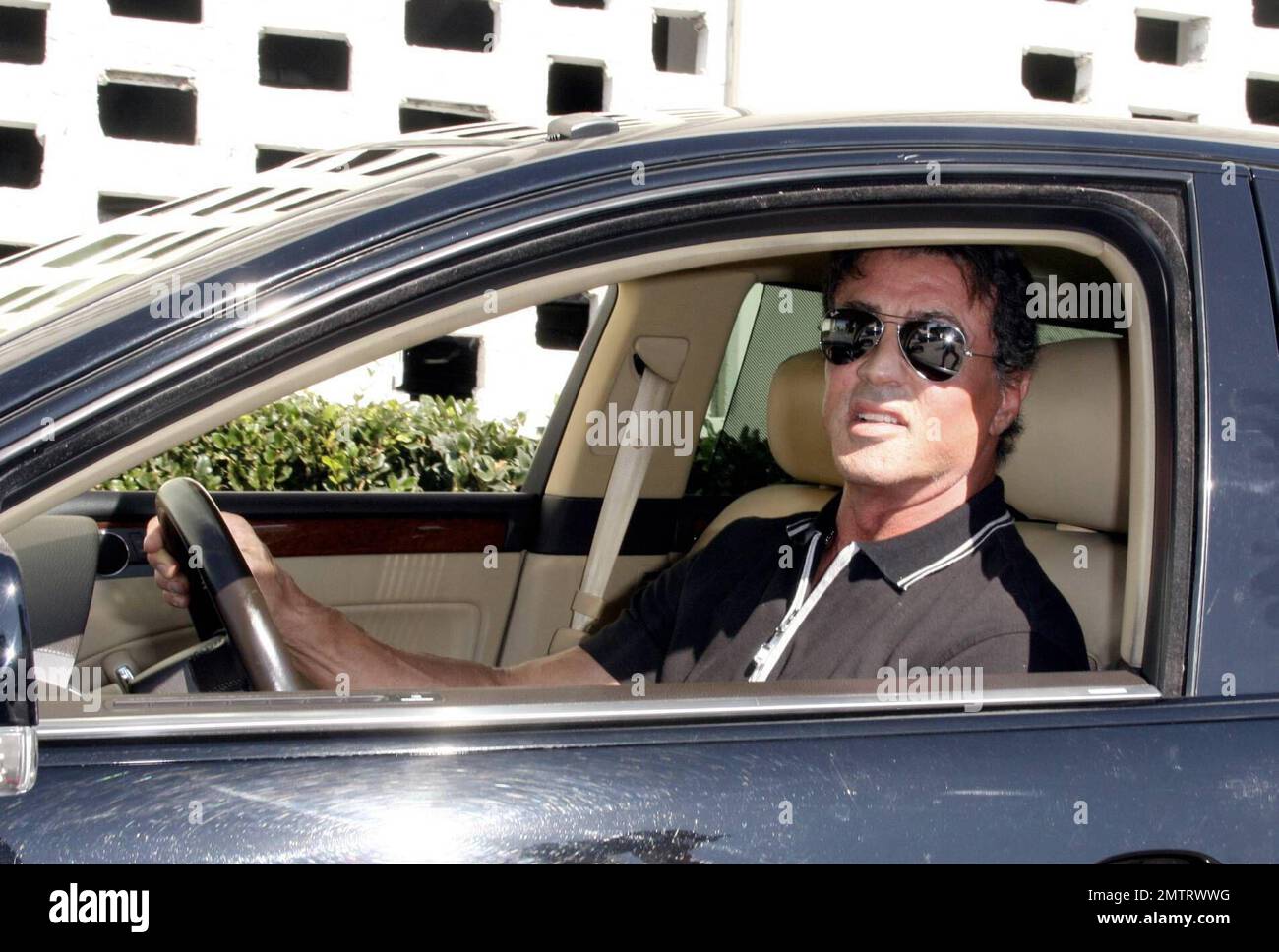 Sylvester Stallone leaves a Beverly Hills cafe with friends after ...