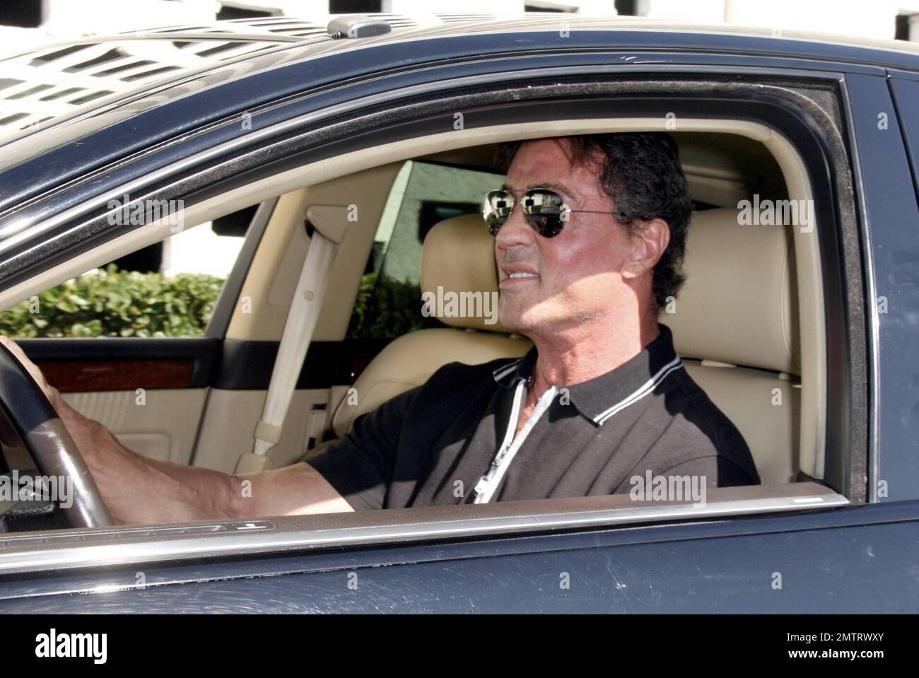 Sylvester Stallone leaves a Beverly Hills cafe with friends after ...