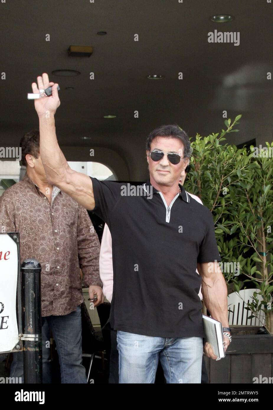 Sylvester Stallone leaves a Beverly Hills cafe with friends after ...