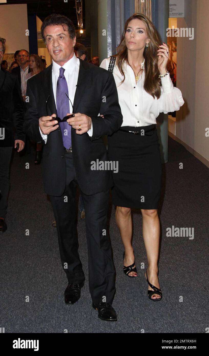Actor Sylvester Stallone, accompanied by wife Jennifer Flavin, exhibits ...