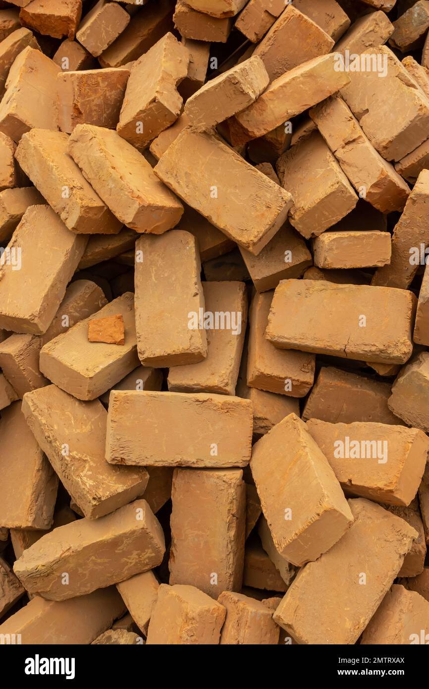 Solid clay brick used for construction. Background, brown red color ...