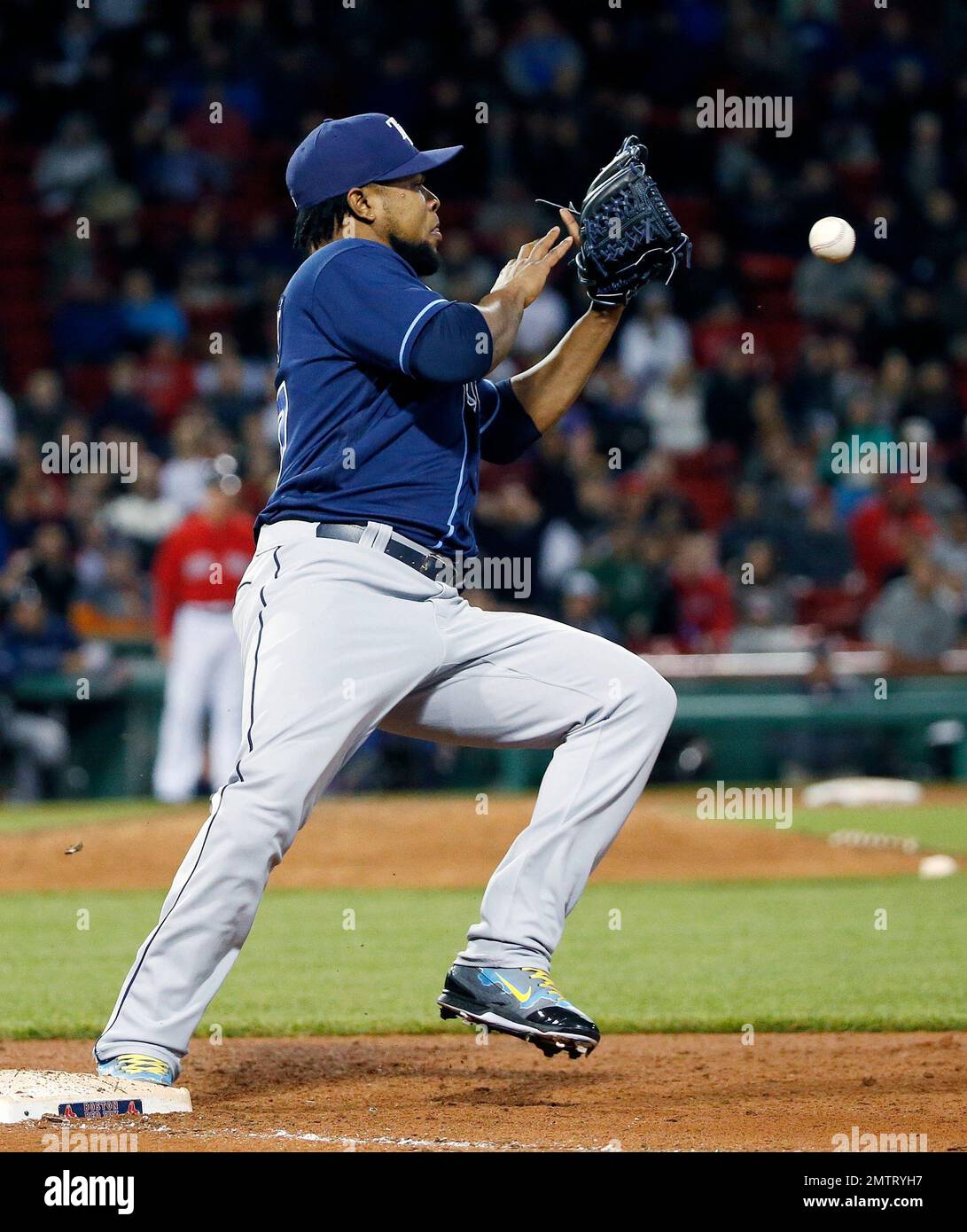 Tampa Bay Rays' Alex Colome makes the play at first base on the ground ...