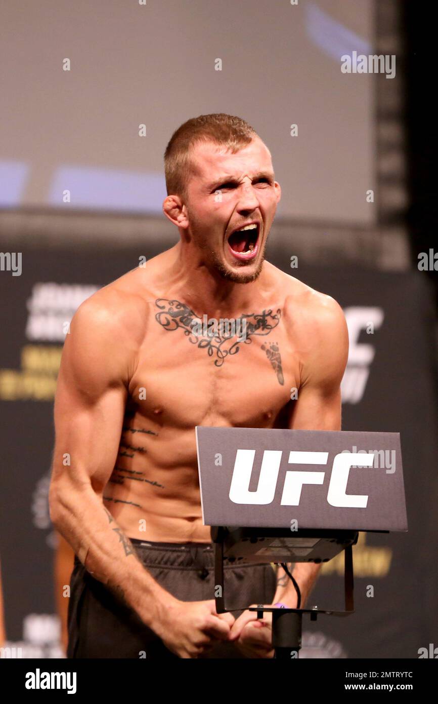 Jason Knight poses for photographers during a weigh-in before UFC 211 ...