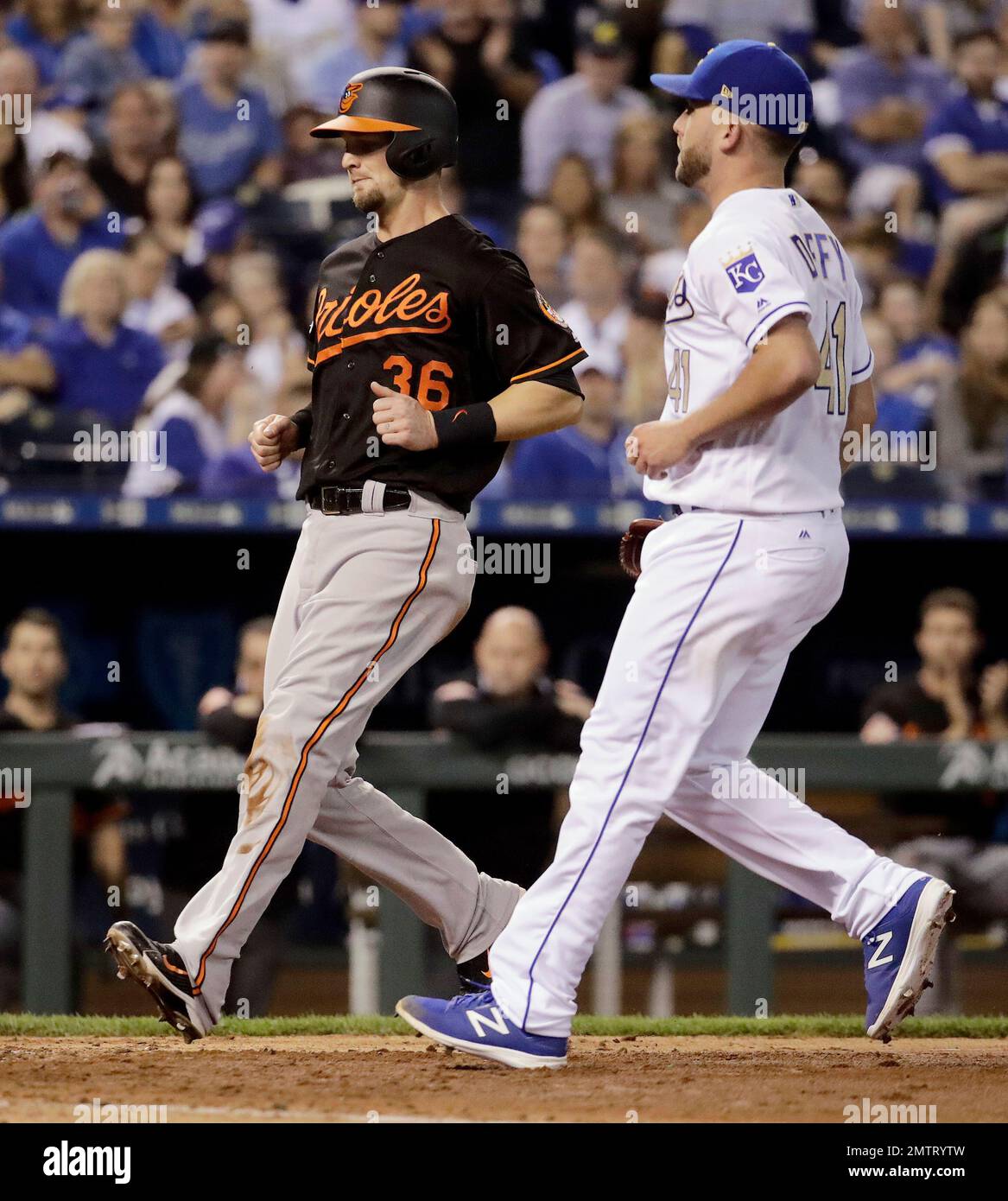 Baltimore Orioles' Caleb Joseph (36) runs home to score on a wild pitch ...