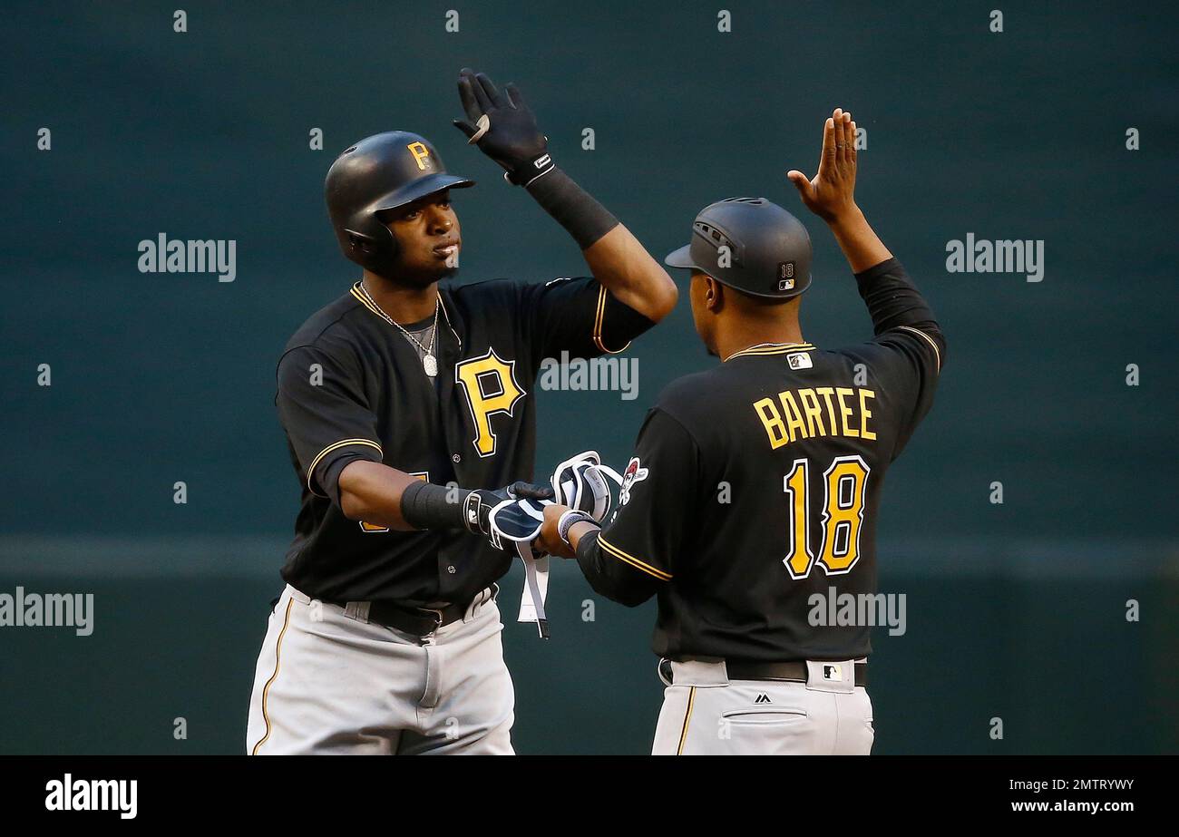 Pittsburgh Pirates' Gregory Polanco, left, celebrates his run-scoring ...