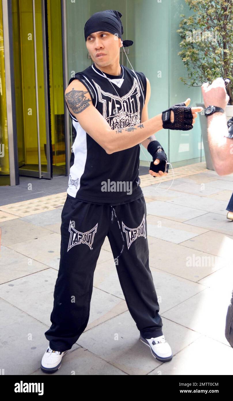 The Black Eyed Peas' Taboo (aka Jaime Luis Gomez) stops to pose for ...