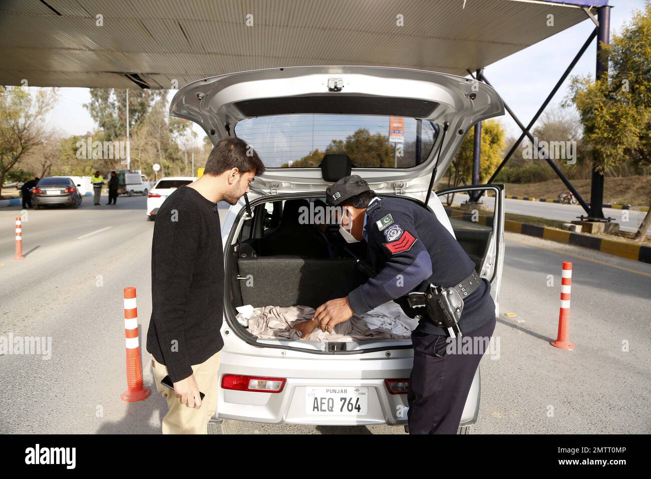 Islamabad. 1st Feb, 2023. A policeman checks a vehicle at a police ...